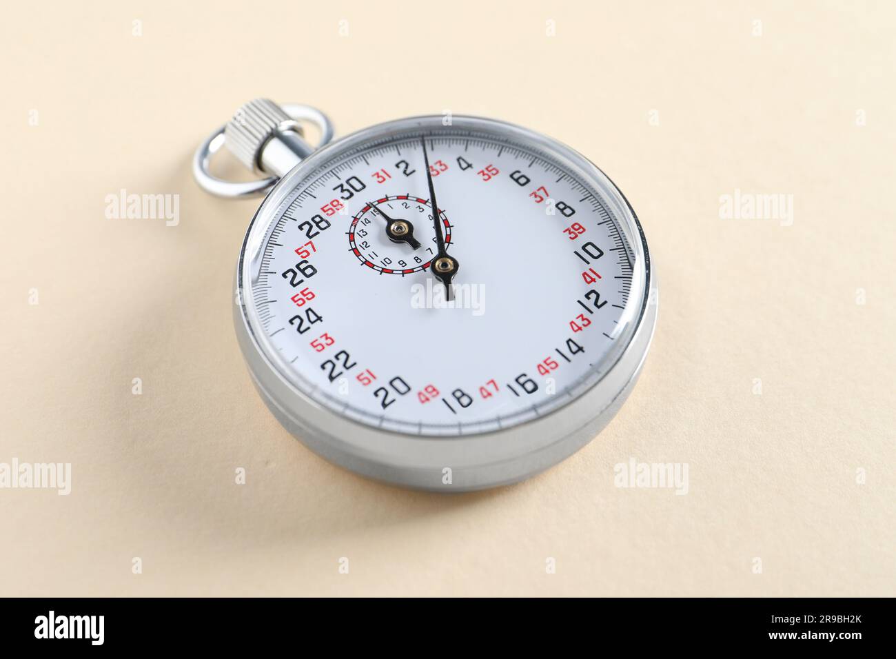 Vintage timer on beige background. Measuring tool Stock Photo - Alamy