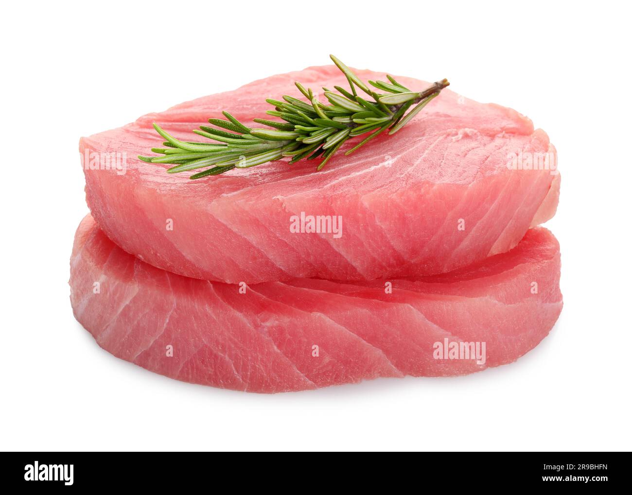 Raw tuna fillets with rosemary on white background Stock Photo - Alamy