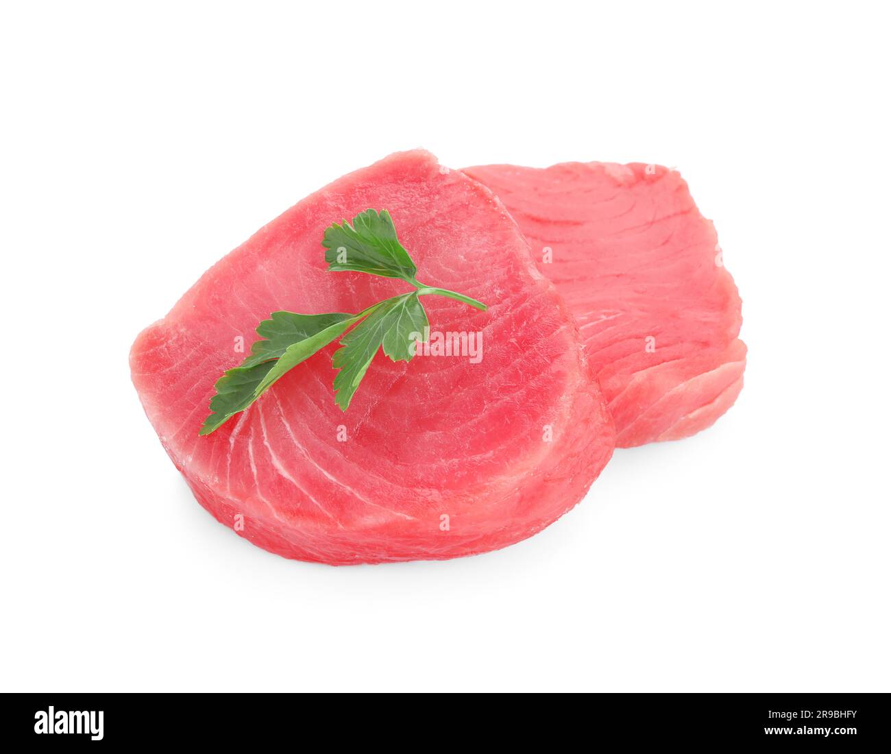 Fresh raw tuna fillets with parsley on white background Stock Photo - Alamy