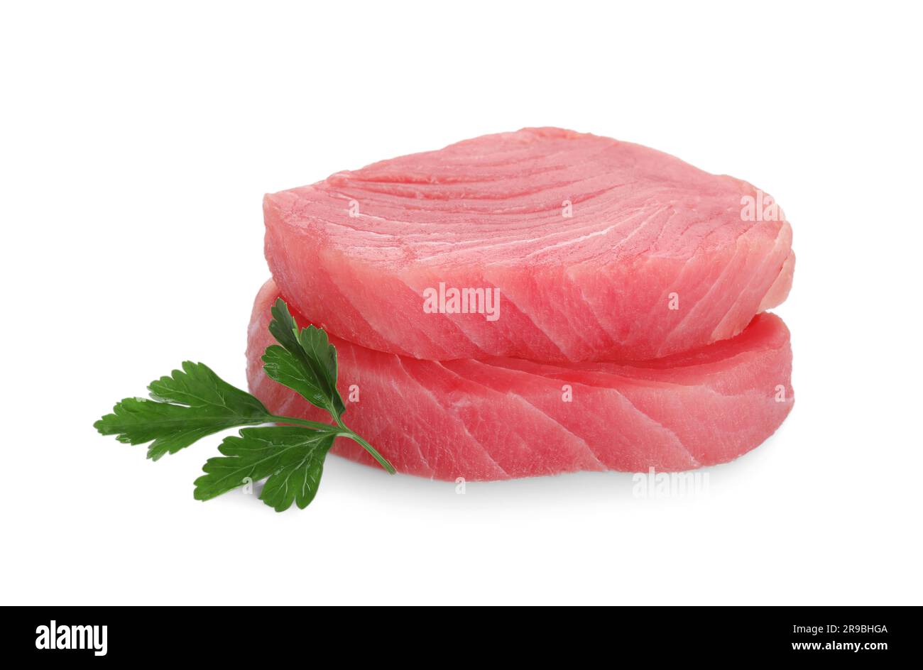 Fresh raw tuna fillets with parsley on white background Stock Photo - Alamy
