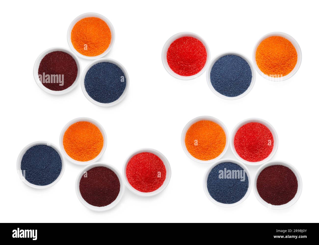 Many different powdered food coloring in bowls isolated on white, top ...