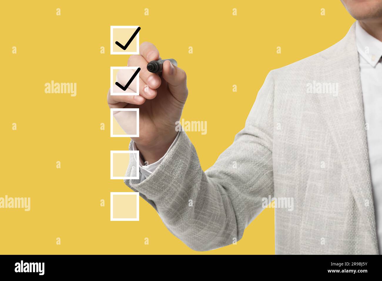 To Do List. Man ticking check boxes with marker on glass board against ...