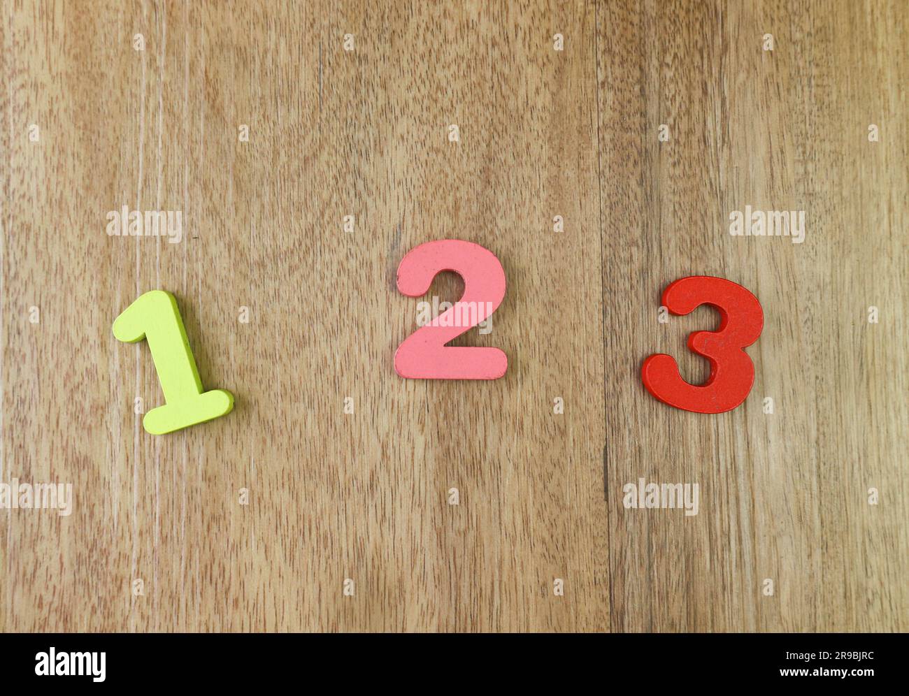 Number one, two and three on the wooden background Stock Photo - Alamy