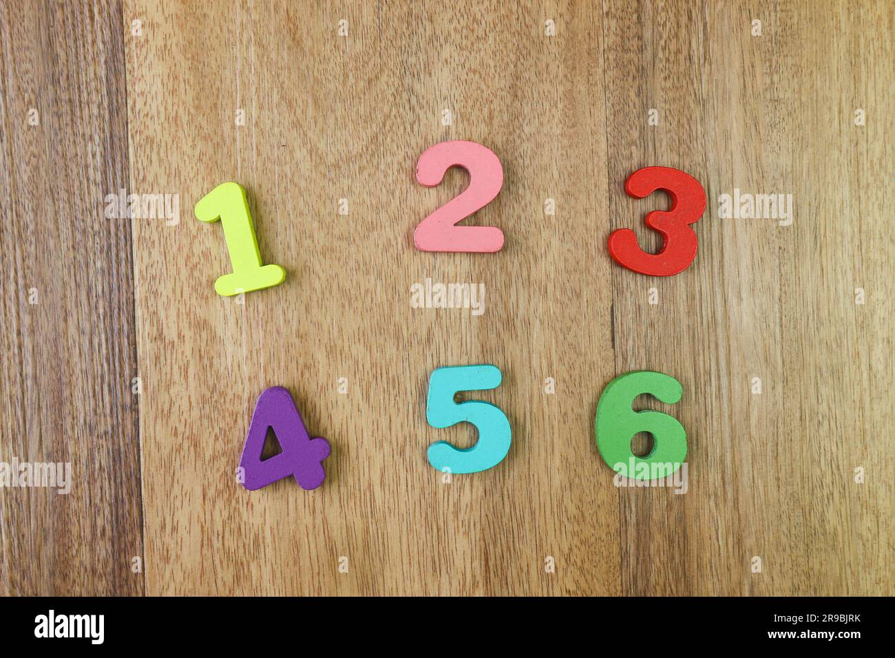 Numbers one, two, three, four, five and six on the wooden background ...