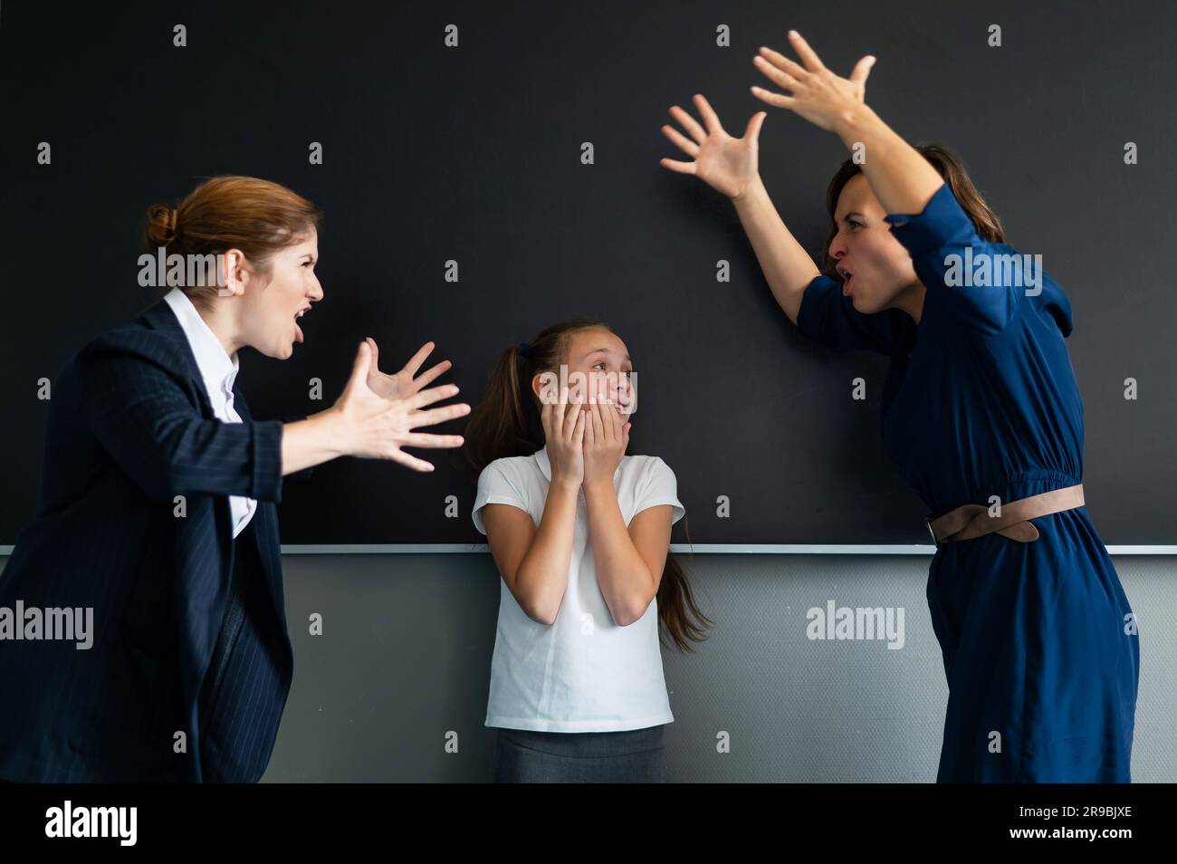A female teacher and a student's mother yell at each other at the ...