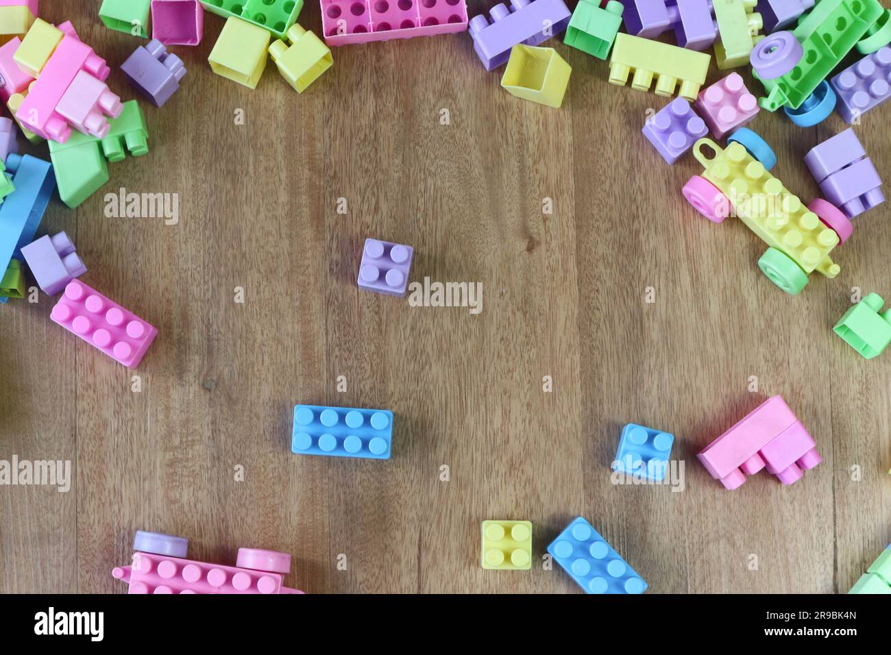 Messy legos on wooden floor, kids toy concept Stock Photo - Alamy