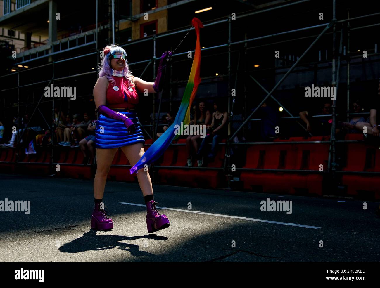 Rei Cusimano, the co-founder of the Seattle Pan Bi Alliance, waves a ...