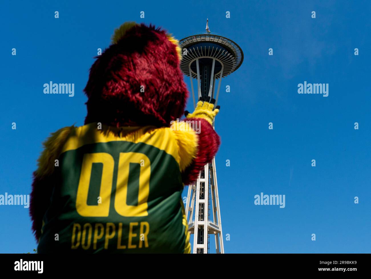 Doppler, the Seattle Storm mascot, waves as the team's float passes by ...