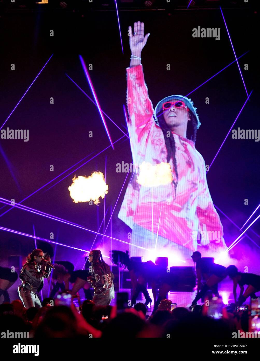An image of Takeoff, the late member of Migos, appears on screen as his ...