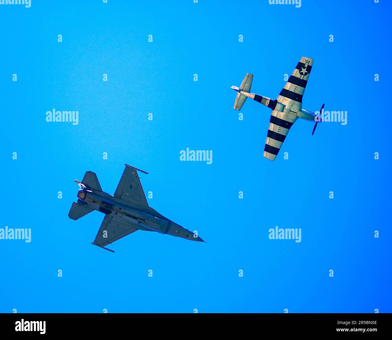 The Mustang and Fighting Falcon flying overhead Stock Photo - Alamy