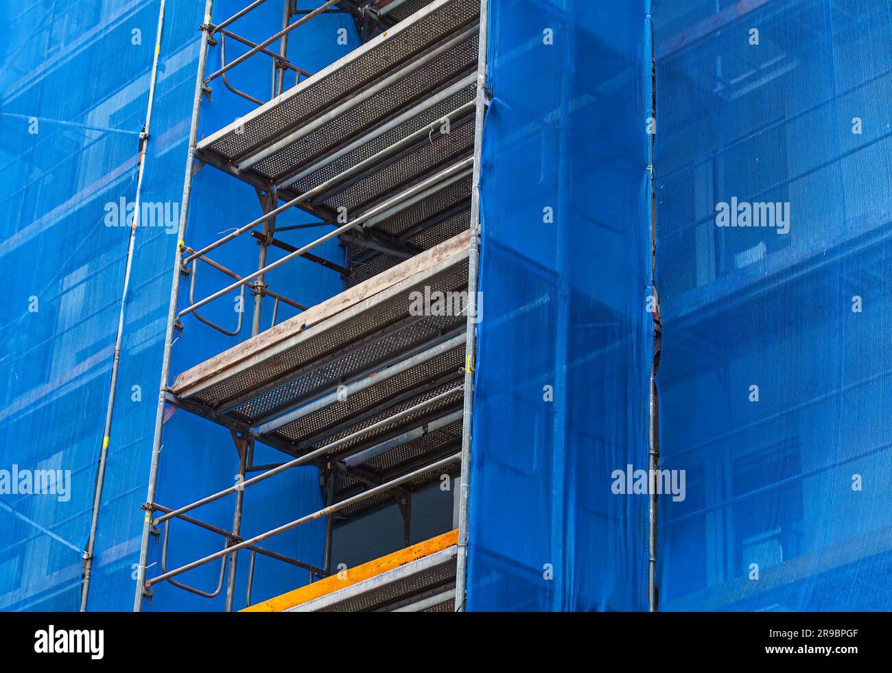 Scaffolding on the facade of a skyscraper, close up of photo ...
