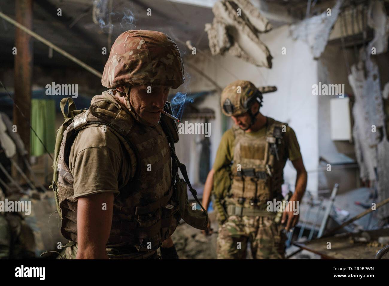 Ukraine. 20th June, 2023. Two soldiers are seen in the basement of a ...