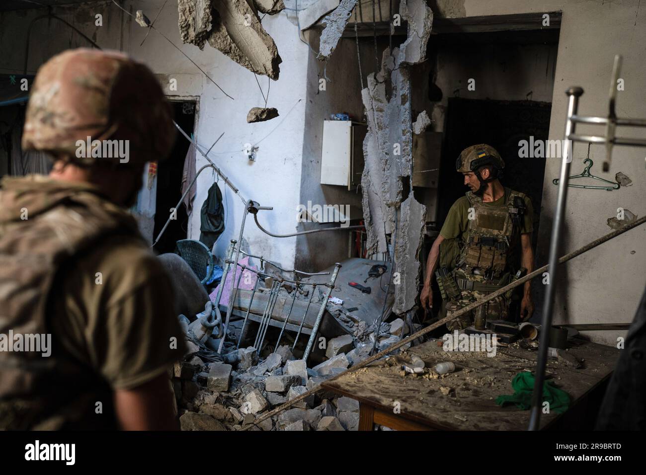Ukraine. 20th June, 2023. Two soldiers are seen in the basement of a ...