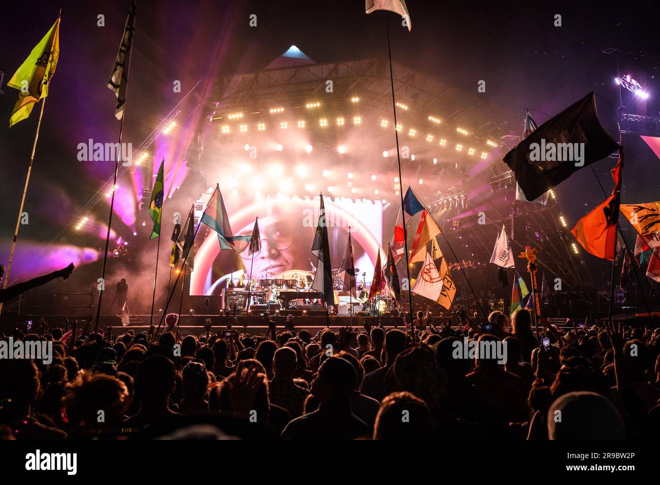 Somerset, UK. 25 June 2023. The crowd watch Elton John performing on ...