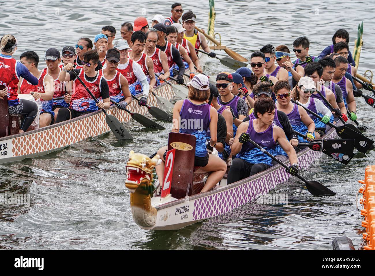 Participants compete in a dragon boat race at the Victoria Harbour. The ...