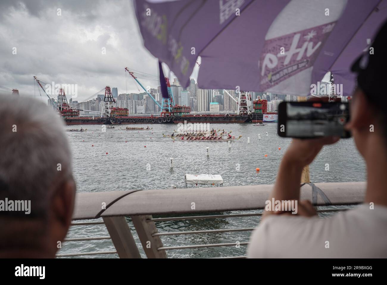 A person takes photos during a dragon boat race. The Hong Kong ...