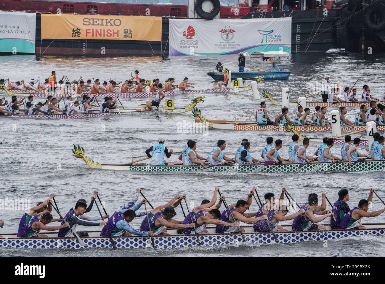 Participants compete in a dragon boat race at the Victoria Harbour. The ...