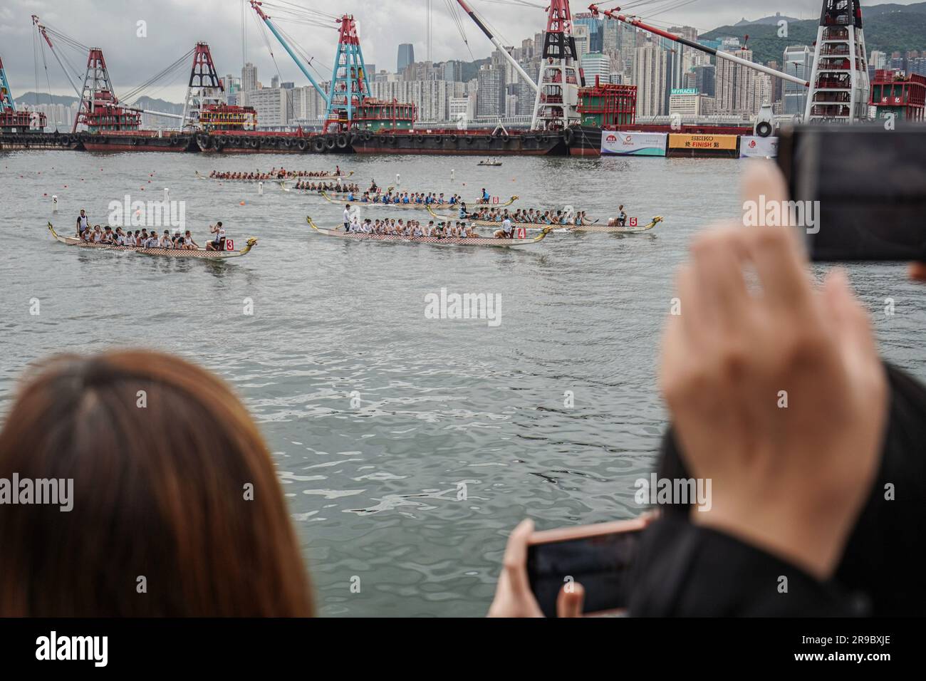 A person takes photos during a dragon boat race. The Hong Kong ...