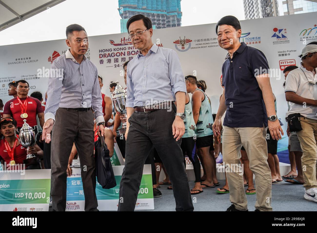 John Lee Ka-Chiu (the middle one), the Chief Executive of Hong Kong ...