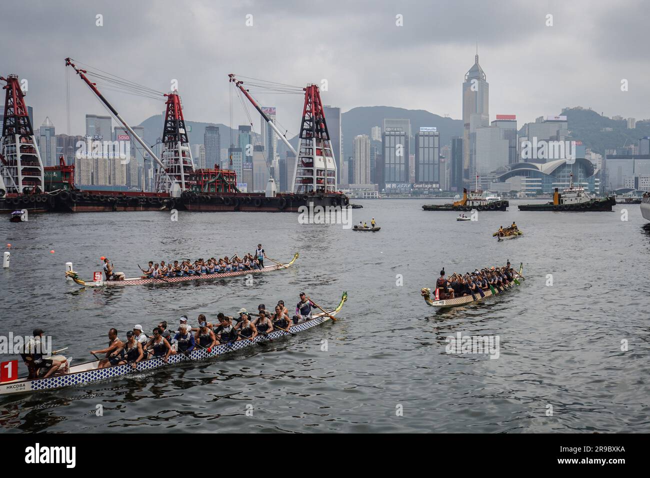 Participants compete in a dragon boat race at the Victoria Harbour. The ...