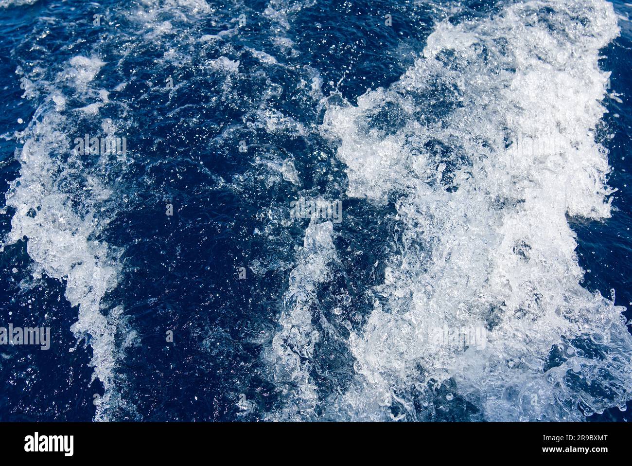 Abstract blue sea water with white waves. Blue sea texture with waves ...