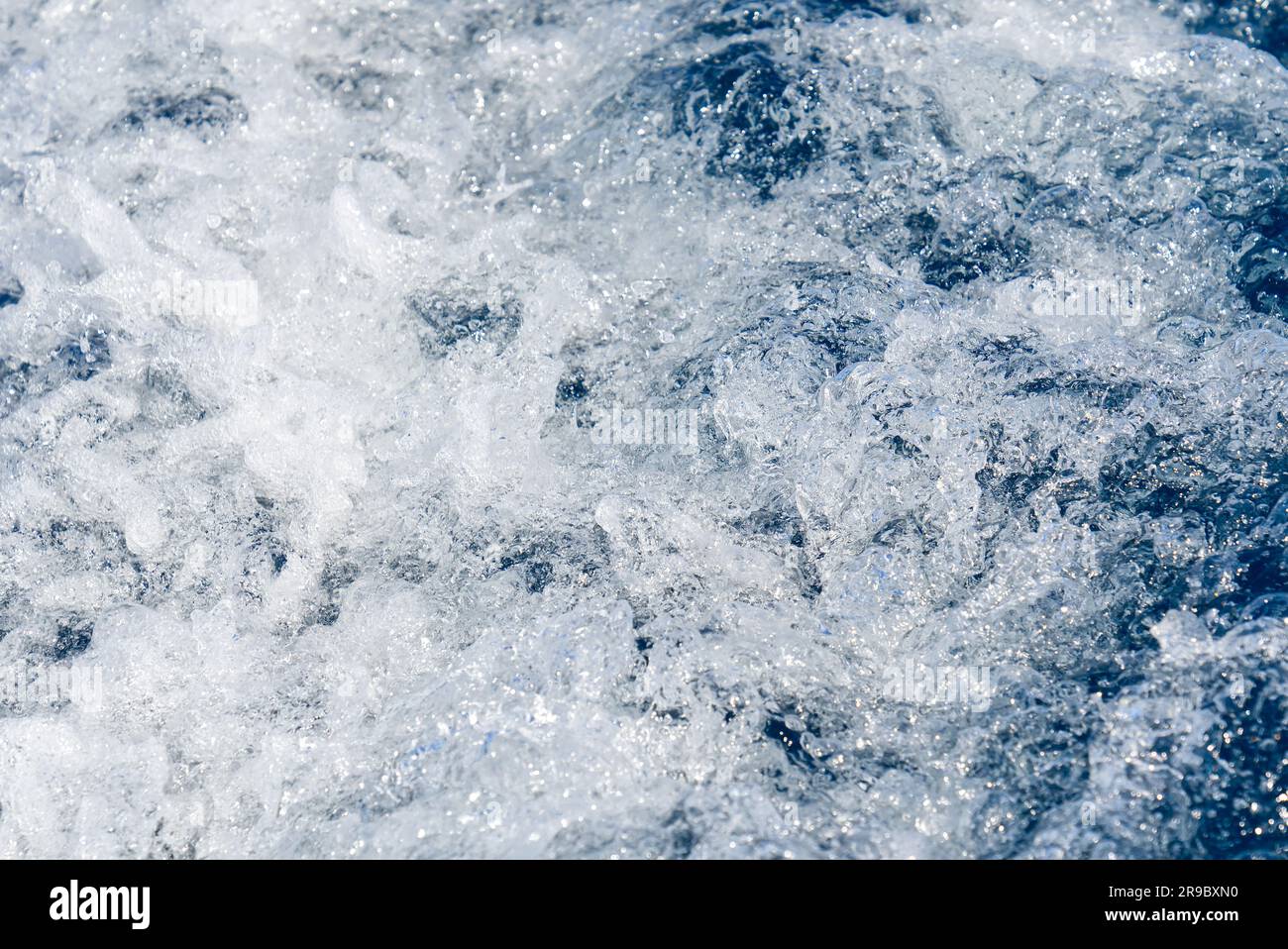 Abstract blue sea water with white waves. Blue sea texture with waves ...