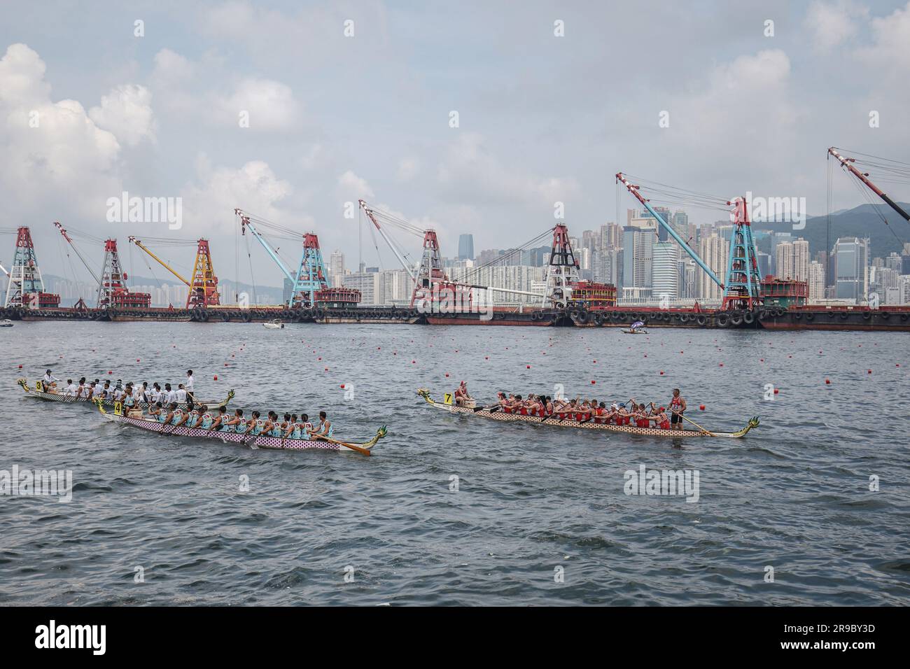 Participants compete in a dragon boat race at the Victoria Harbour. The ...