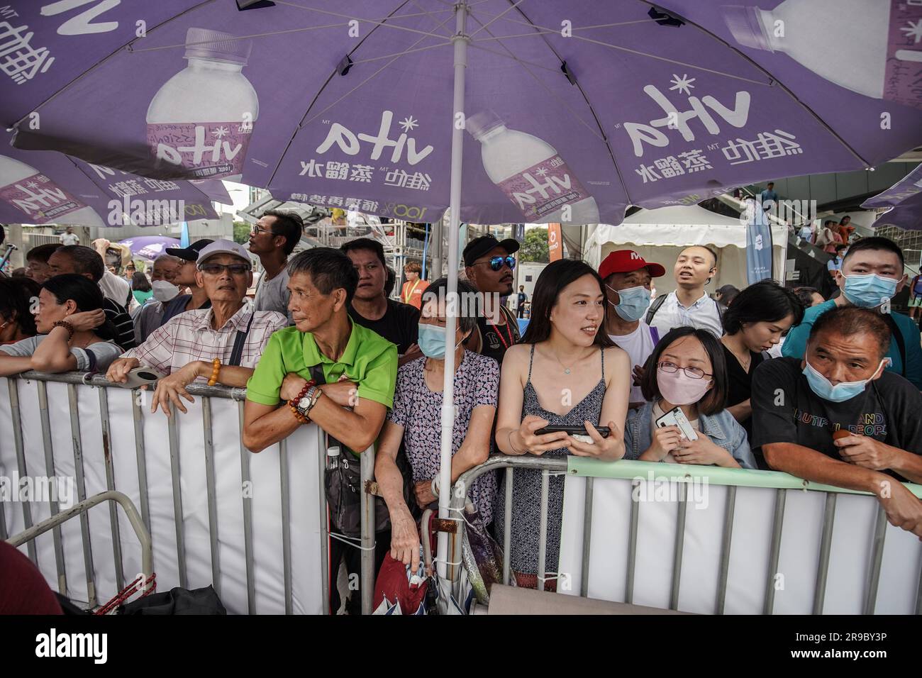 People gather at Tsim Sha Tsui East Waterfront to watch the dragon boat ...