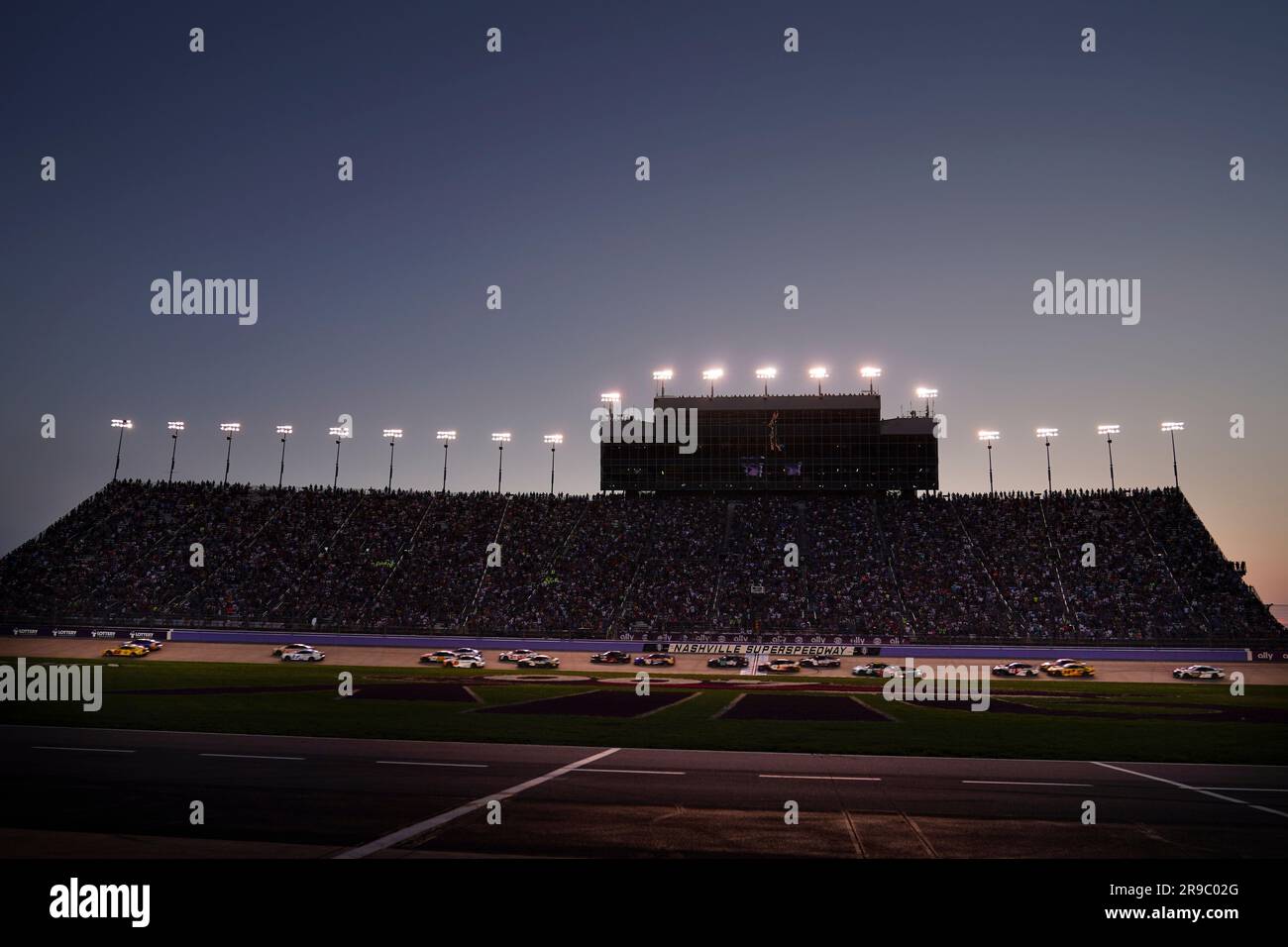Drivers compete during a NASCAR Cup Series auto race under the lights ...