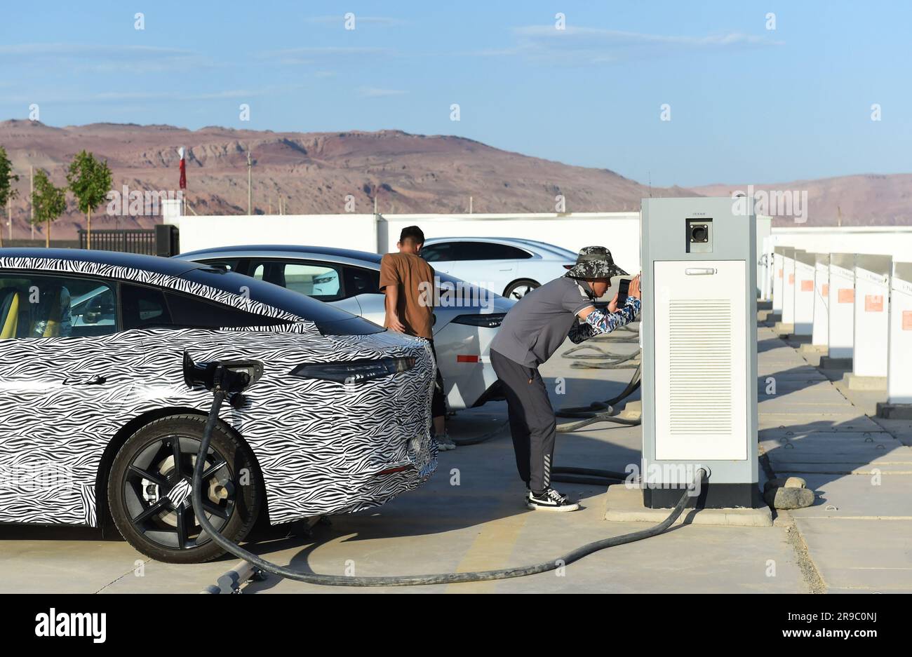TURPAN, CHINA - JUNE 25, 2023 - Vehicles perform a high temperature ...