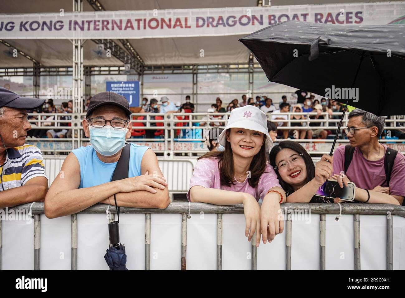 People gather at Tsim Sha Tsui East Waterfront to watch the dragon boat ...