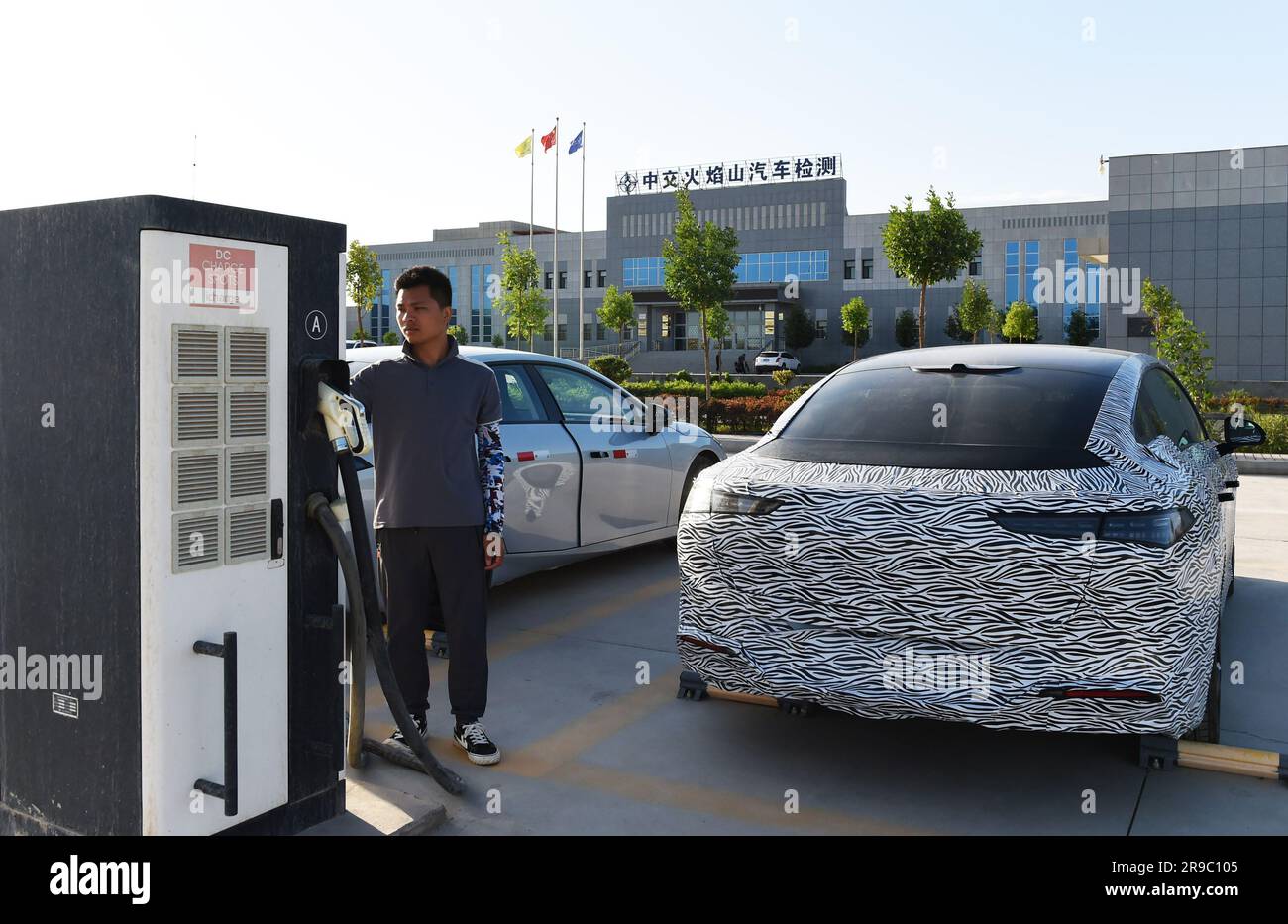 TURPAN, CHINA - JUNE 25, 2023 - Vehicles undergo a charging test at the ...