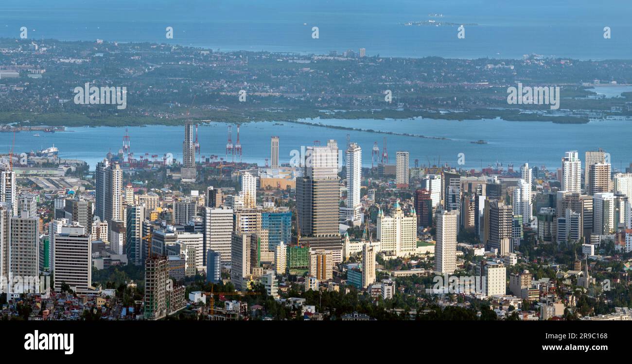 Light from the setting sun bathes the high-rise buildings in the ...