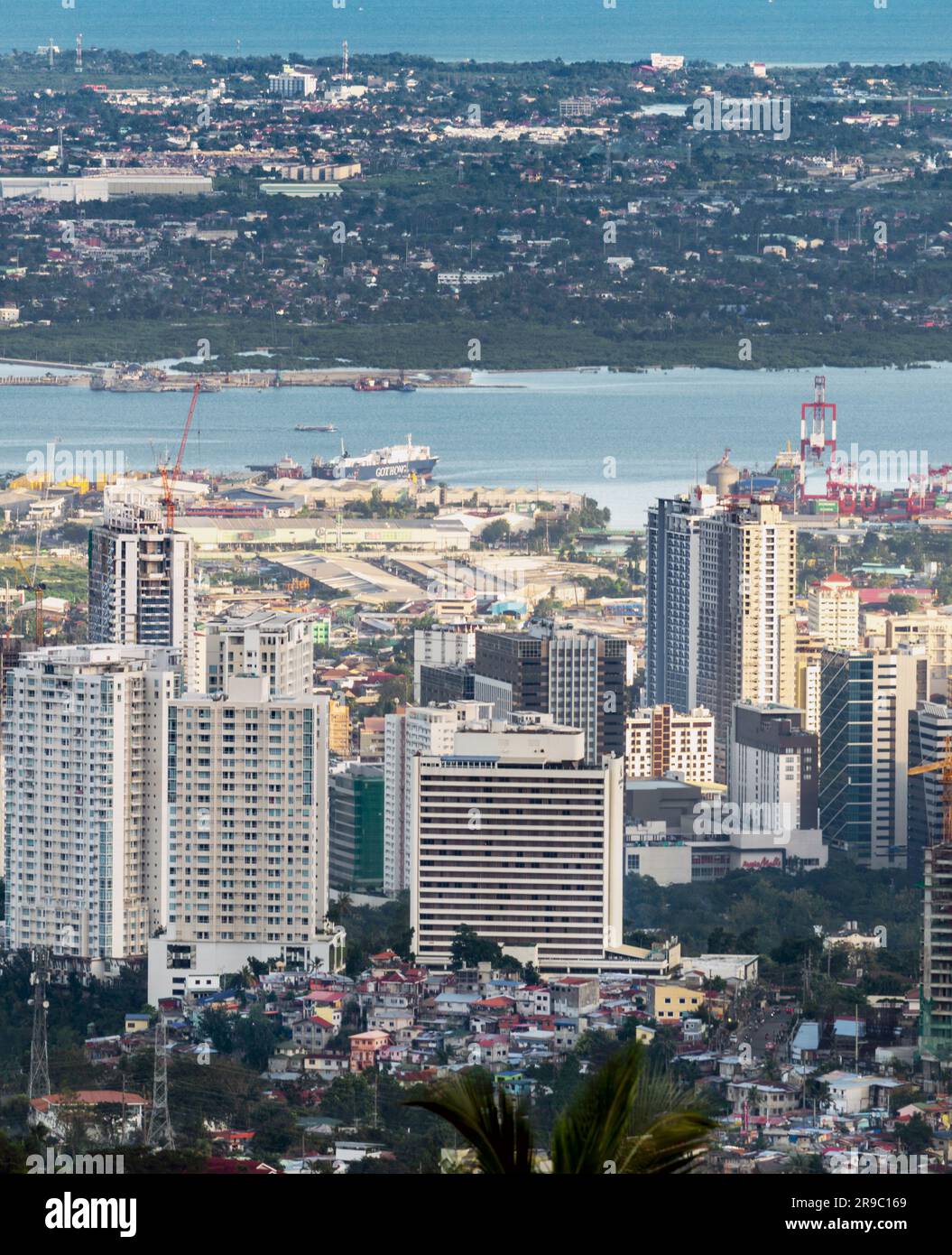 Pre-sunset sunlight bathes the taller buildings of Cebu's capital ...
