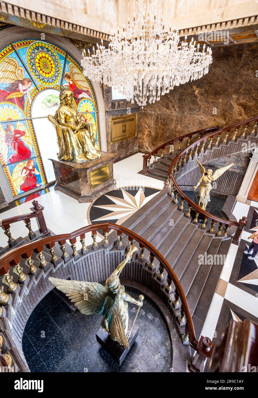 The grand,opulent stairs lead up to a large bronze image of Leah atop a ...