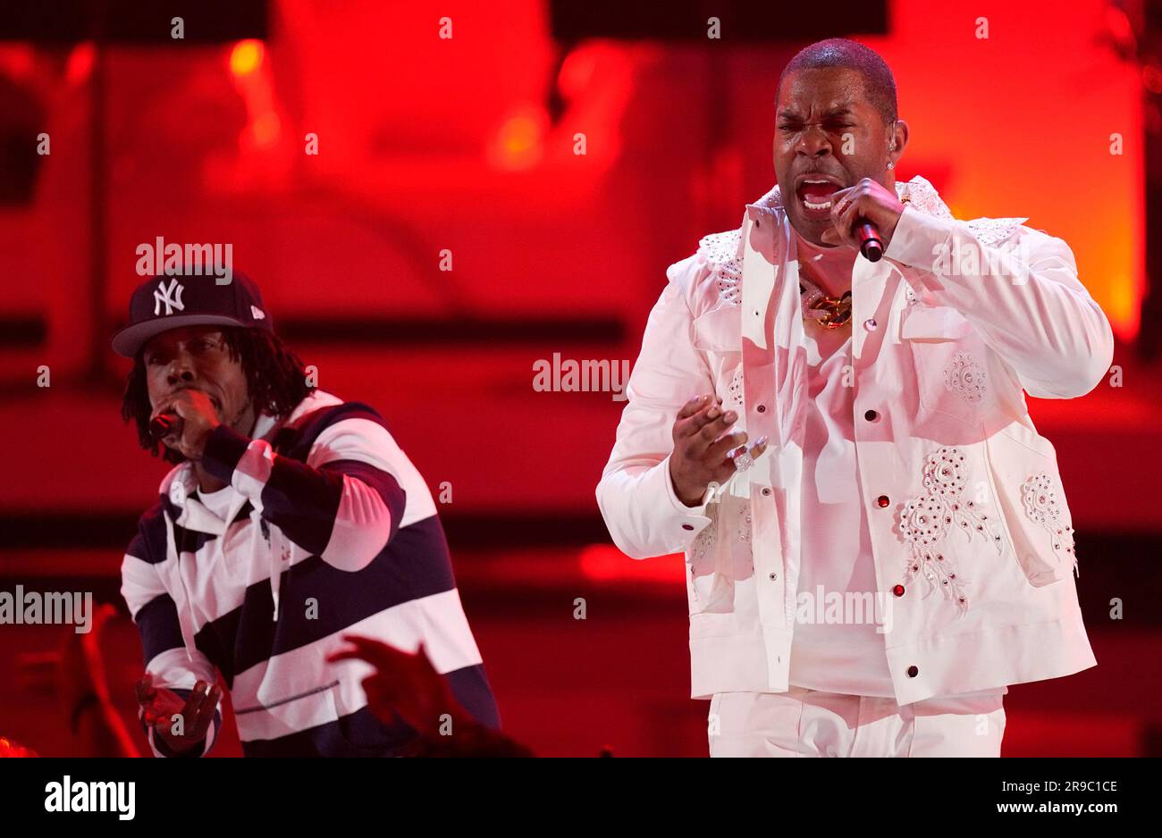 Lil' Fame of M.O.P., left, performs with Busta Rhymes during his ...