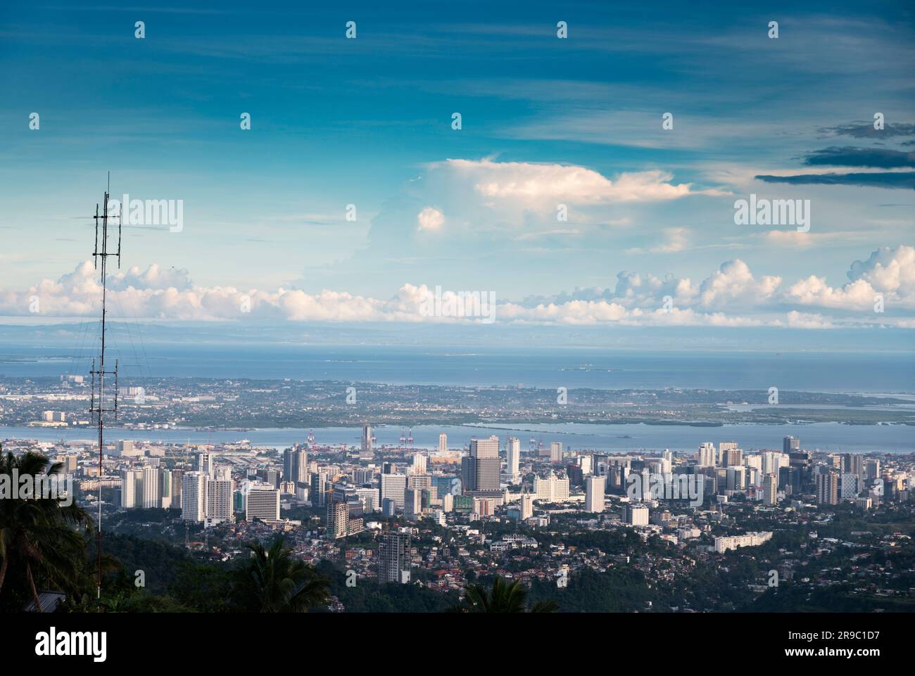Pre-sunset sunlight bathes the taller buildings of Cebu's capital ...