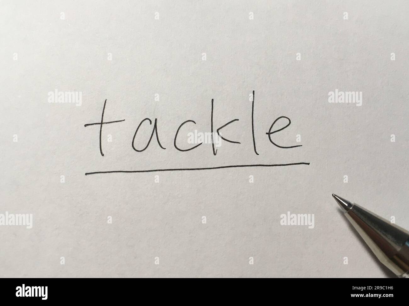 Tackle concept word on paper background Stock Photo - Alamy