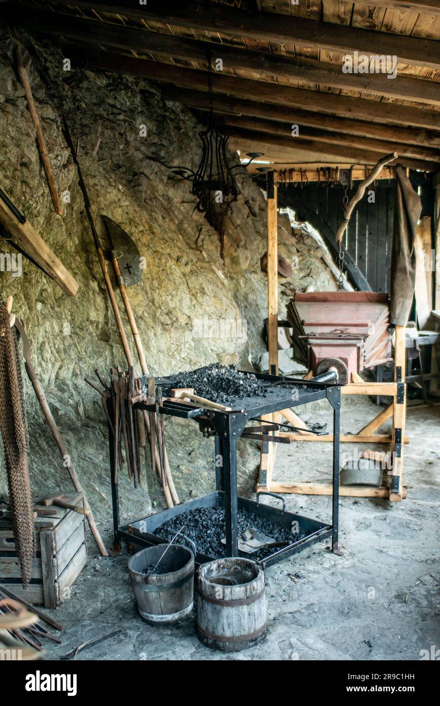 View of traditional blacksmith's shop for forging medieval iron, with ...