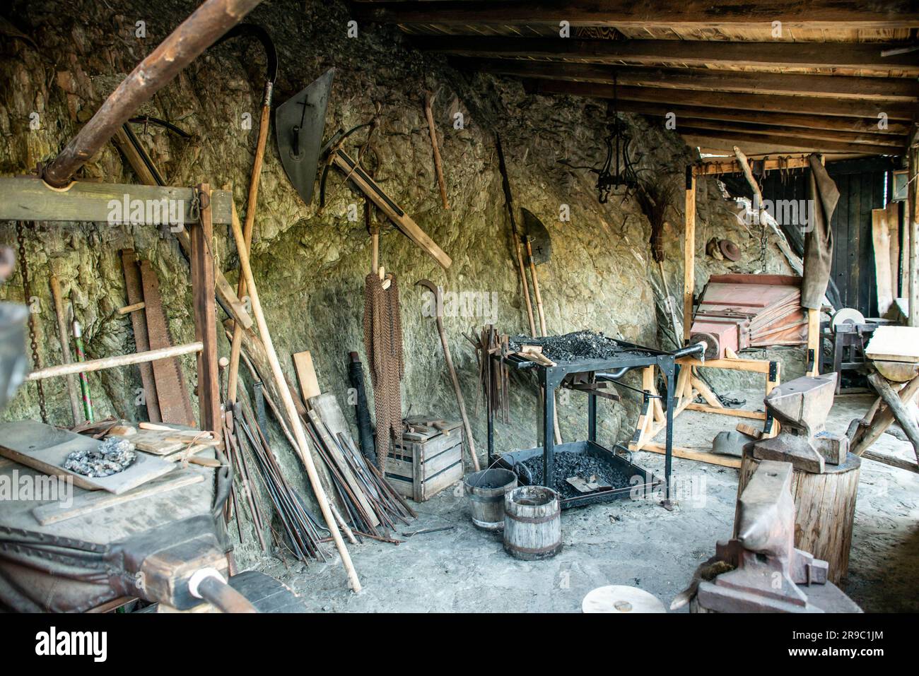 View of traditional blacksmith's shop for forging medieval iron, with ...