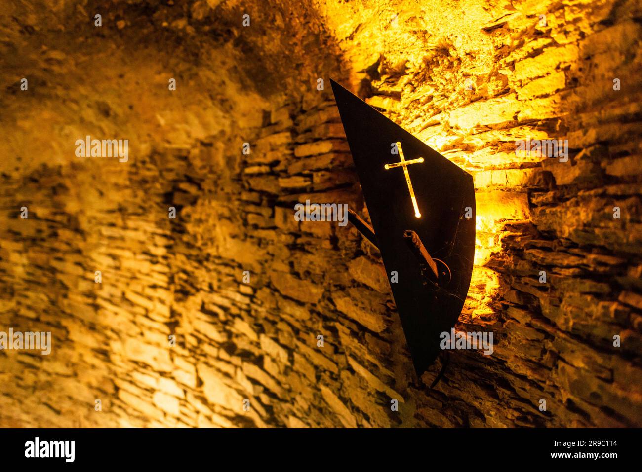 Old light at night hanging on a medieval fortress wall background torch ...