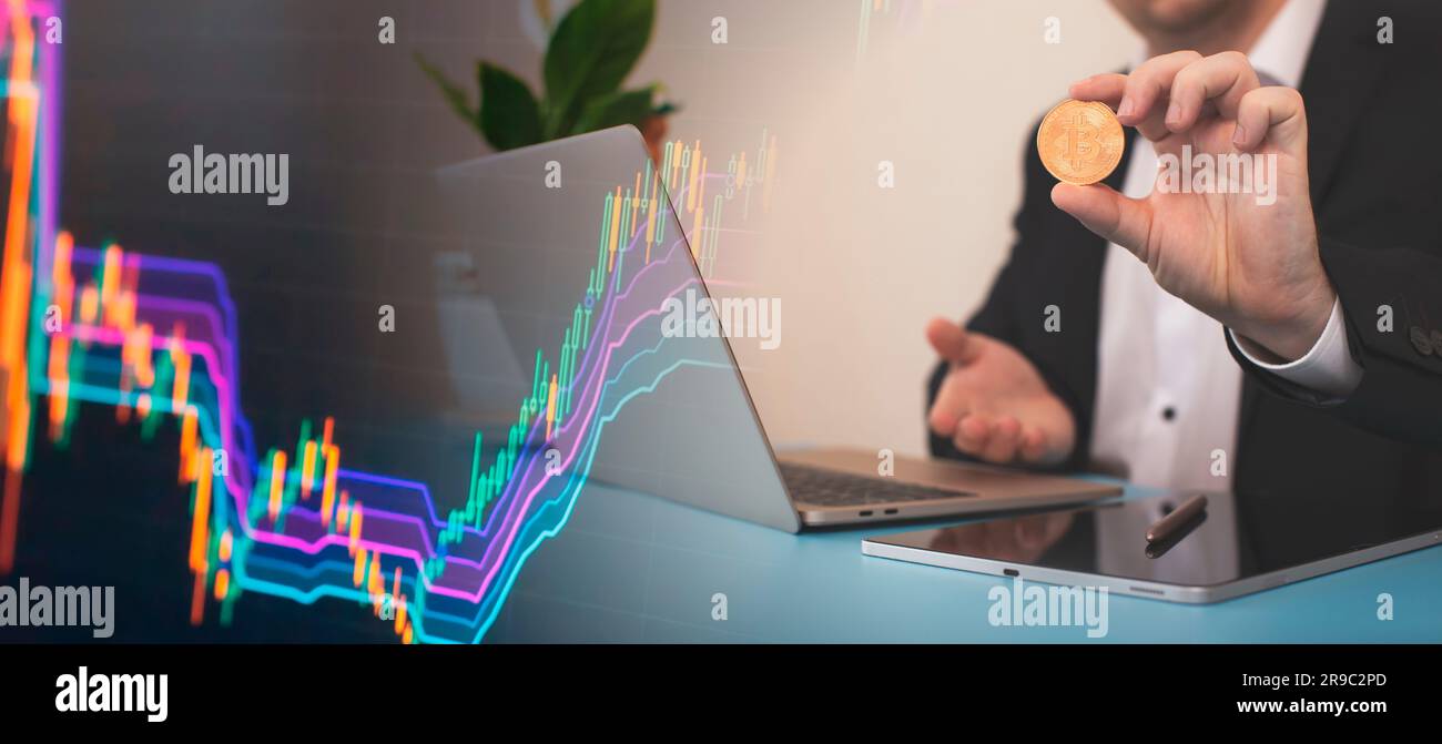 Laptop with chart and bitcoin in hands. Cryptocurrency gold coin, stock ...