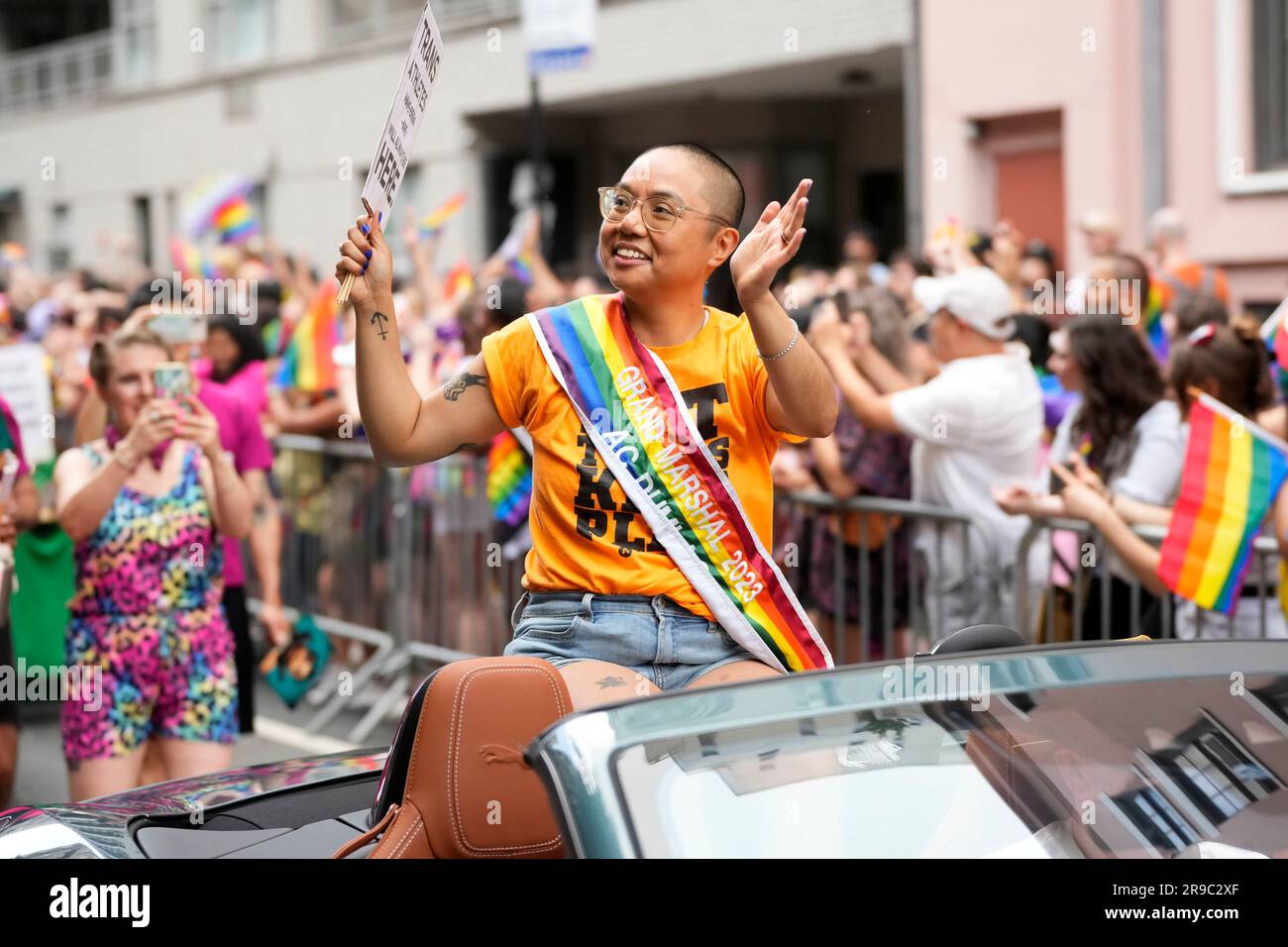 Grand Marshal AC Dumlao rides in a convertible in the NYC Pride March ...