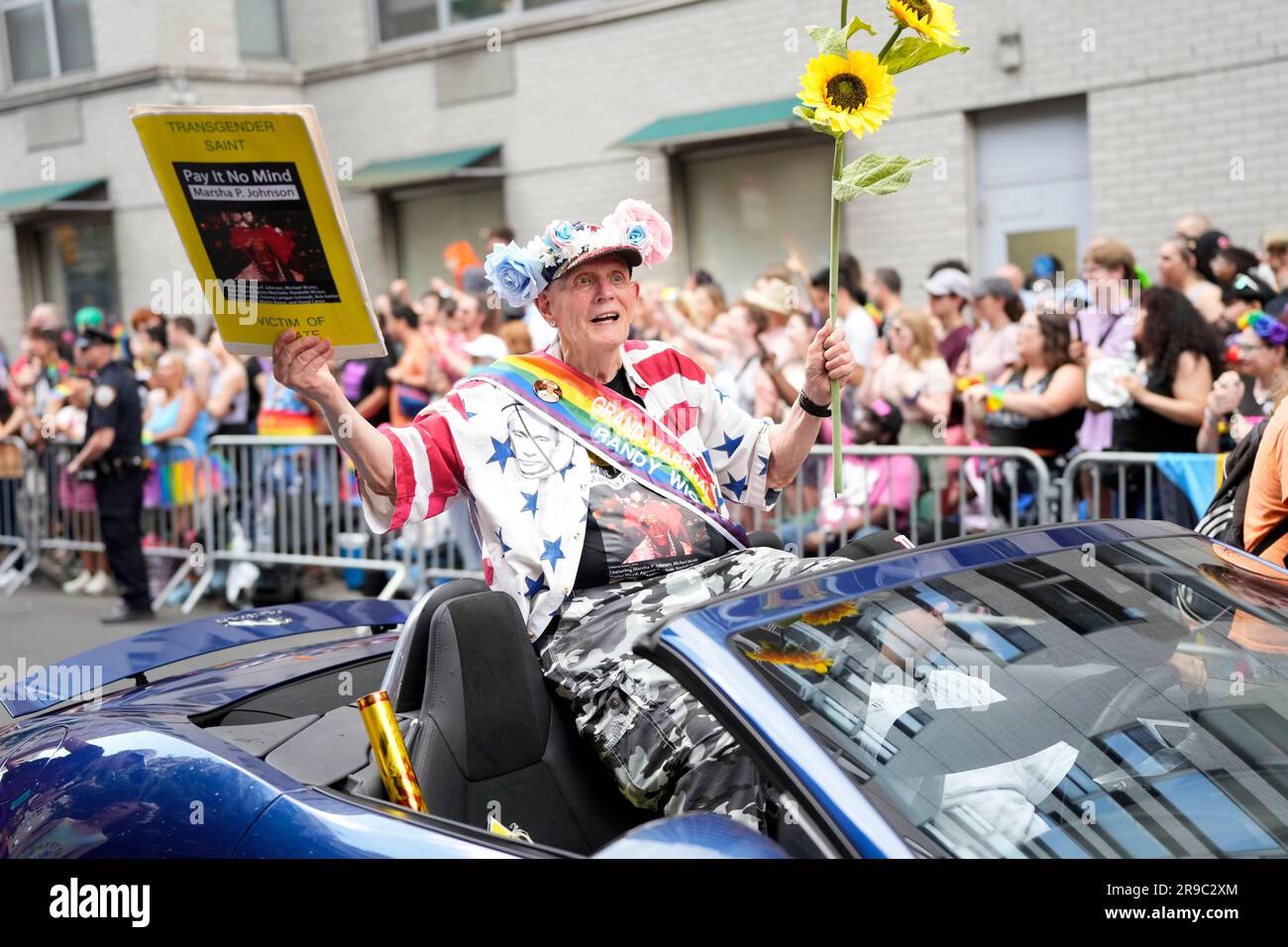 Grand Marshal Randy Wicker rides in a convertible in the NYC Pride ...