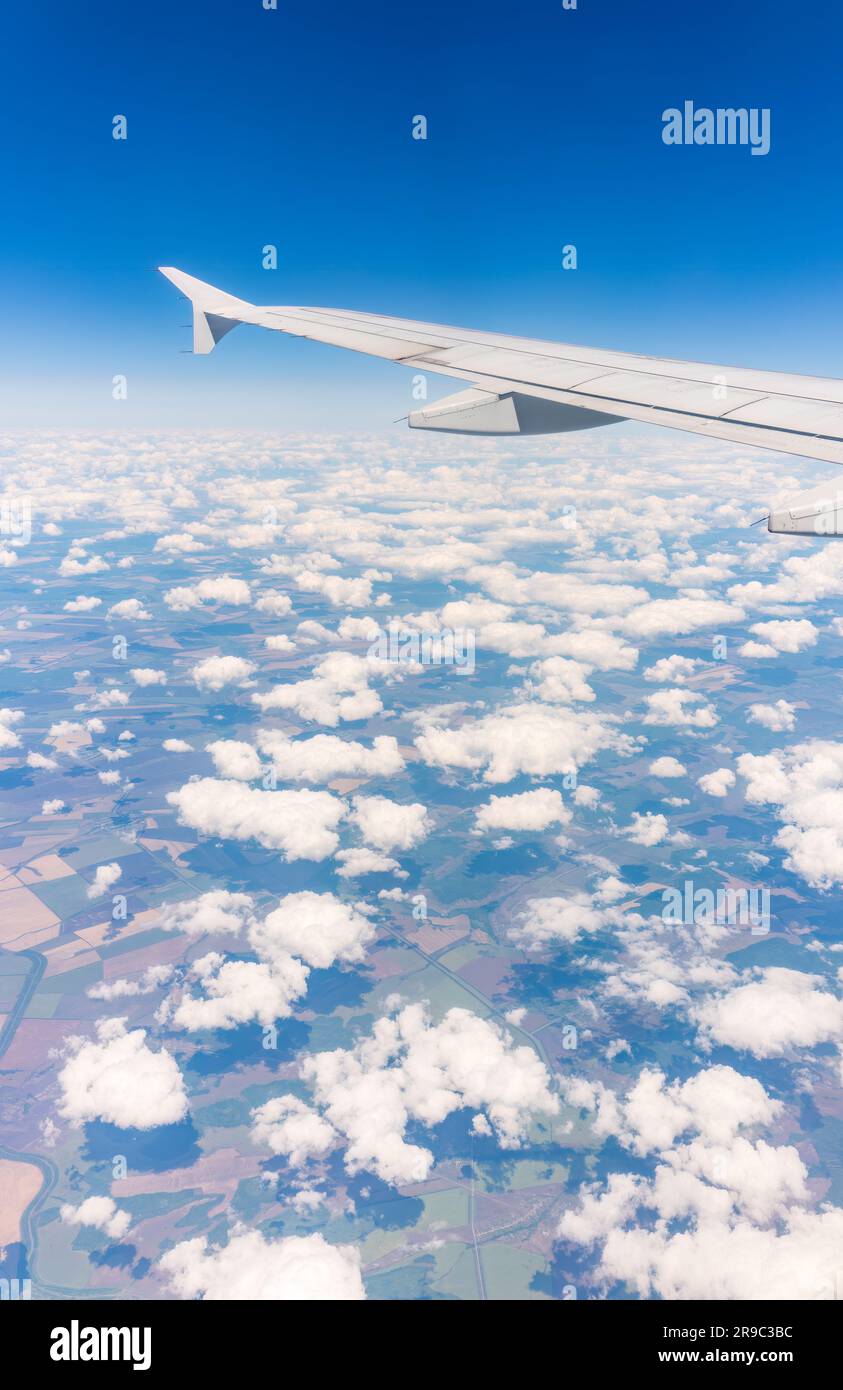 View from the airplane window at a beautiful cloudy sky and the ...