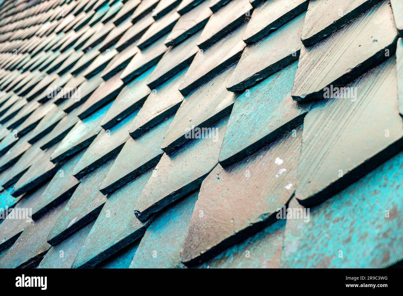Wall fragment with medieval ceramic tiles in diamond scale shape ...