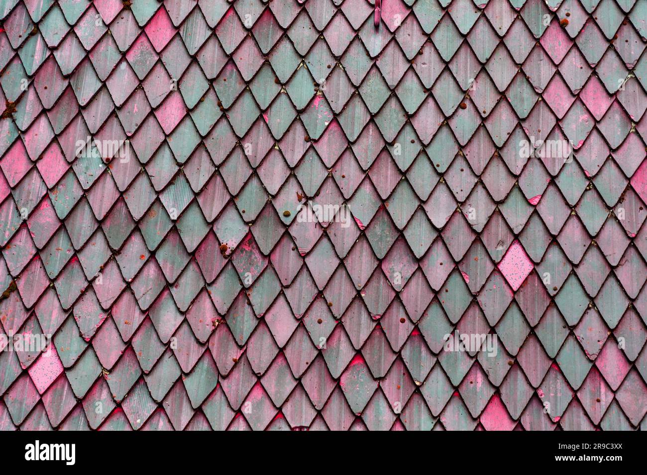 Wall fragment with medieval ceramic tiles in diamond scale shape ...