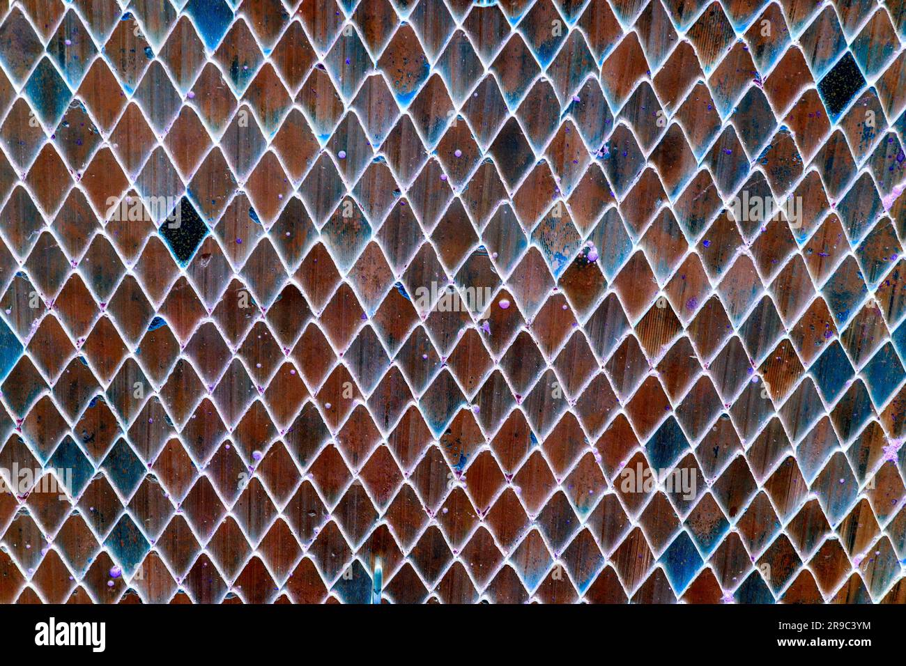 Wall fragment with medieval ceramic tiles in diamond scale shape ...