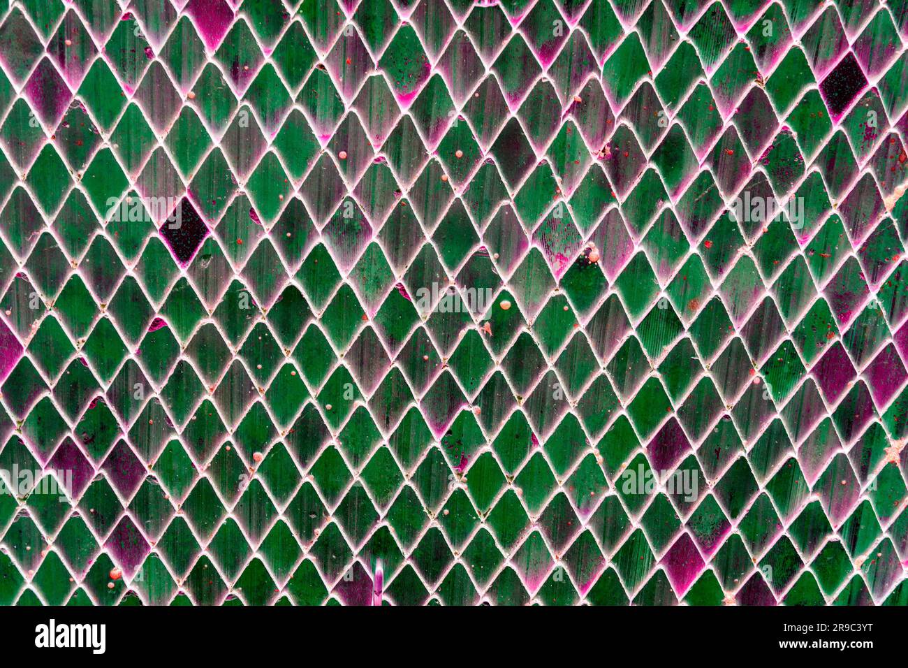 Wall fragment with medieval ceramic tiles in diamond scale shape ...