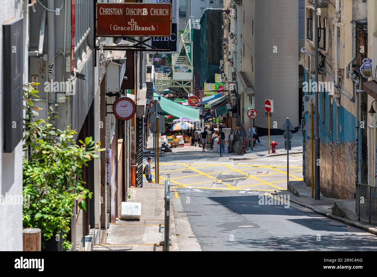 Street market, steep slope, tall buildings landscape, mid levels, Hong ...